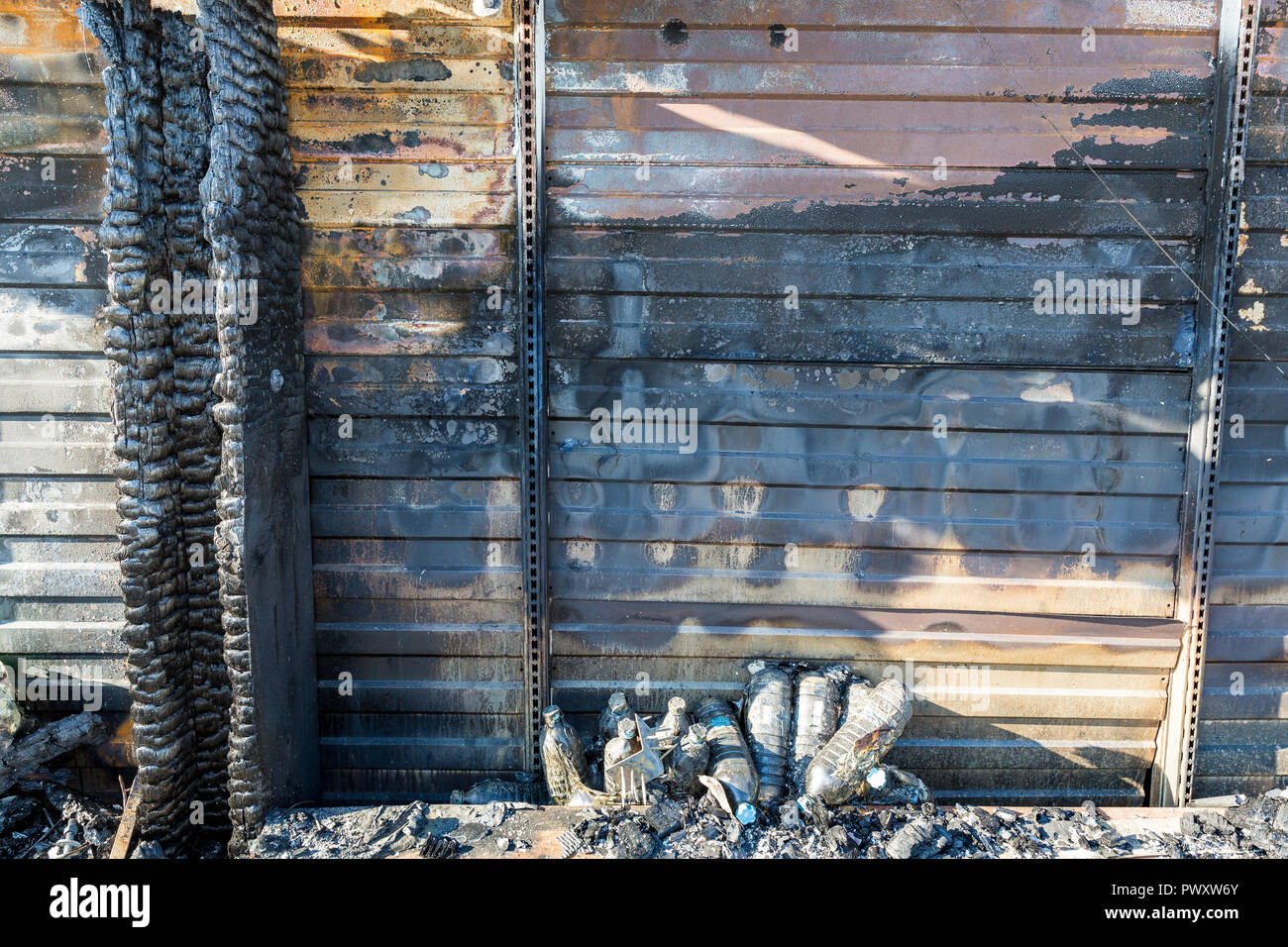 Close up damaged industry supermarket metallic facade after arson fire ...