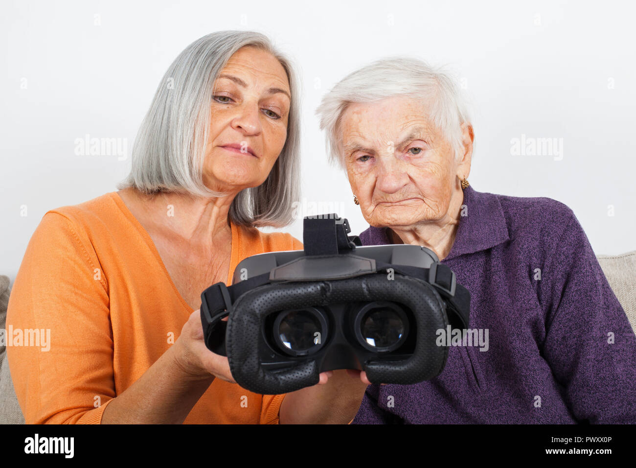 Elderly women experiencing virtual reality video with headset Stock ...