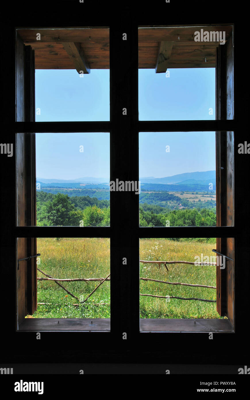 nature landscape with a view through a wooden frame window Stock Photo ...