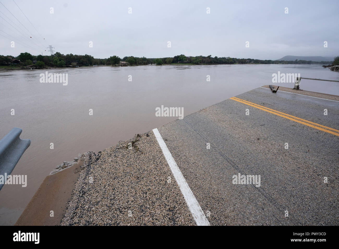 A 1,000-foot span of the RR2900 bridge over the Llano River is washed ...
