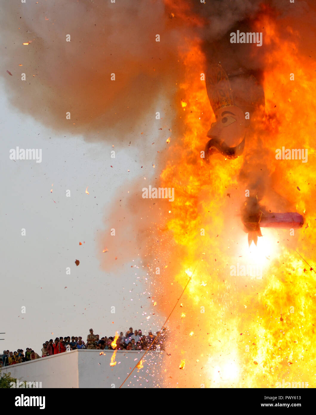 Jammu, Indian-controlled Kashmir. 18th Oct, 2018. People watch as an ...