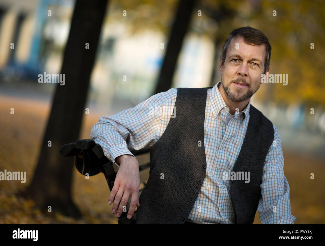 Dresden, Germany. 18th Oct, 2018. Opera singer Georg Zeppenfeld sits on ...