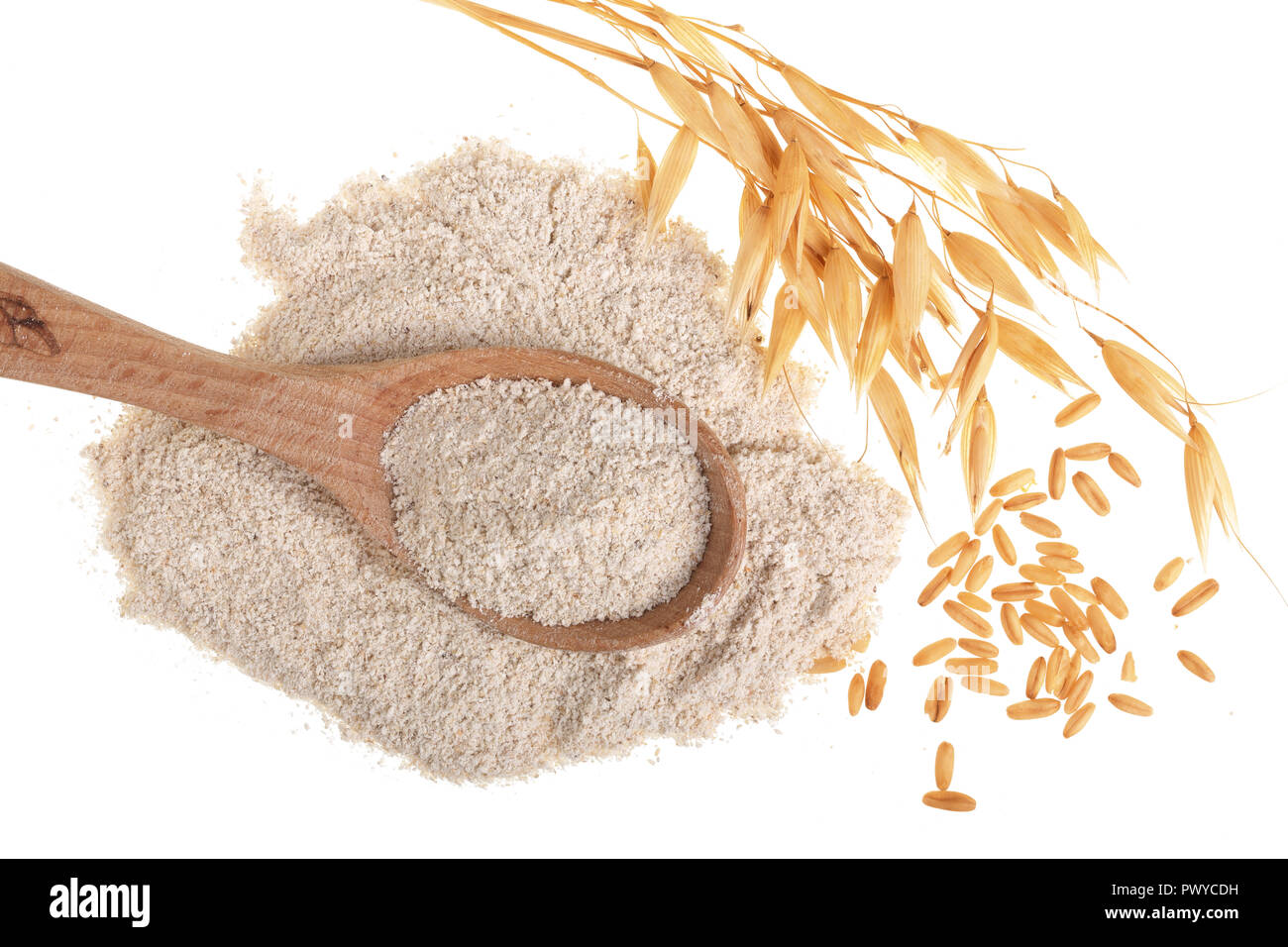 oat spike with flour in wooden spoon isolated on white background. Top ...