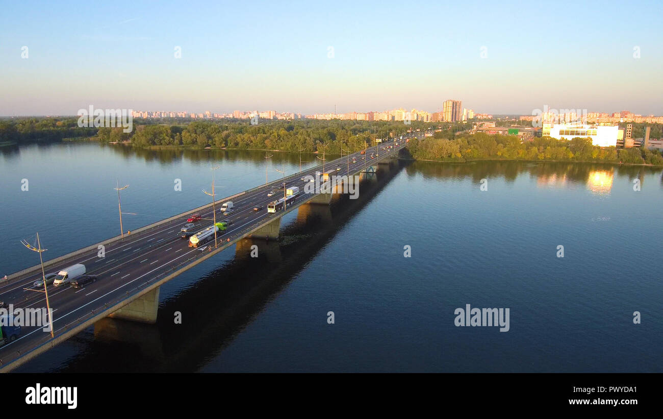 Aerial Drone Flight: View of the bridge over the river with cars Stock ...
