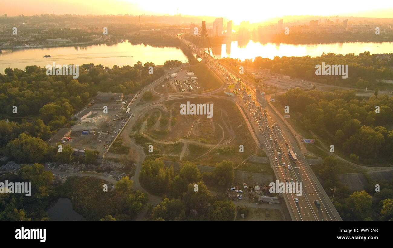 Aerial Drone Flight: View of the bridge over the river with cars Stock ...