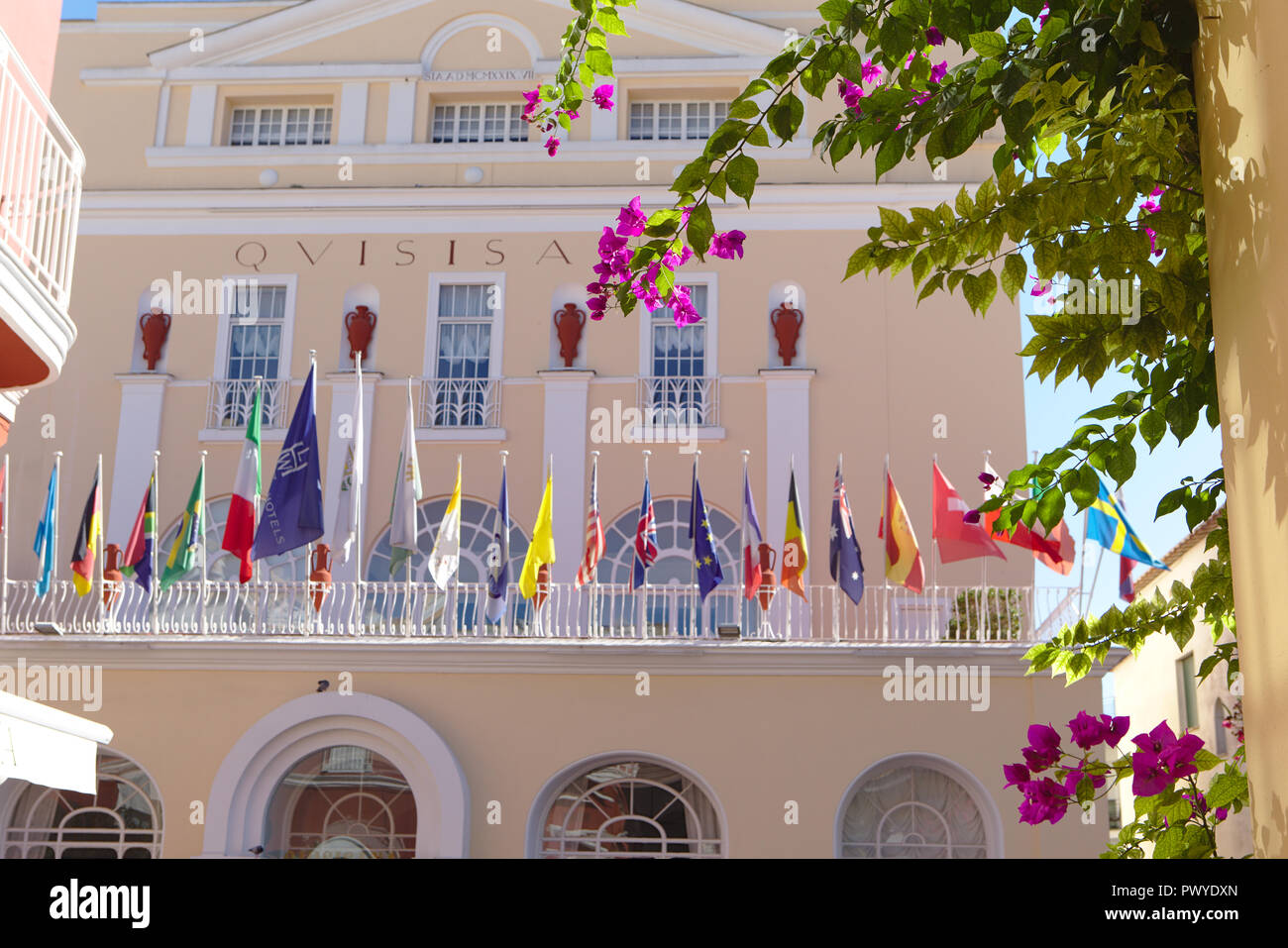 Building with colourful flags in capri hi-res stock photography and ...