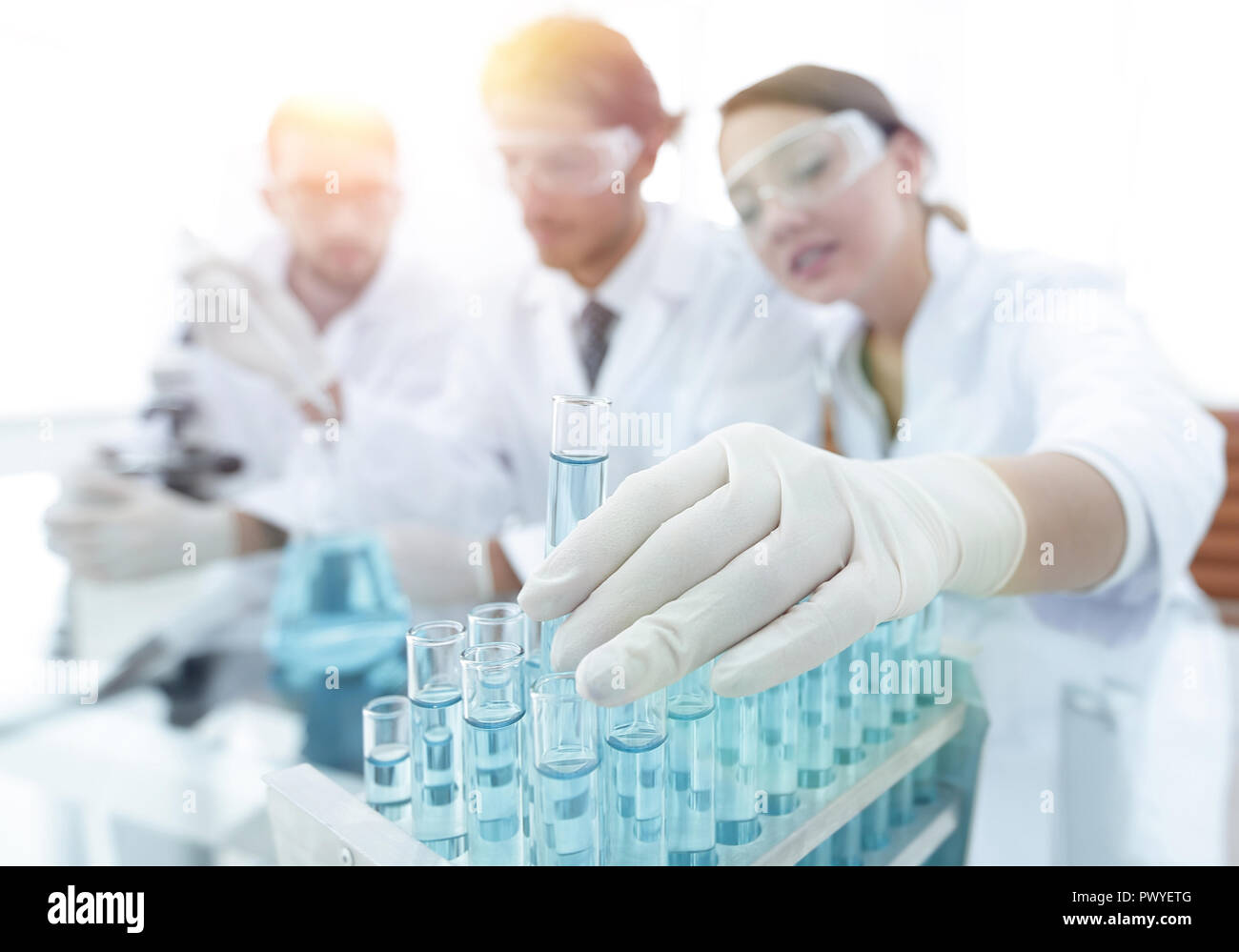 Scientist holding test tube or some equipment of science Stock Photo ...