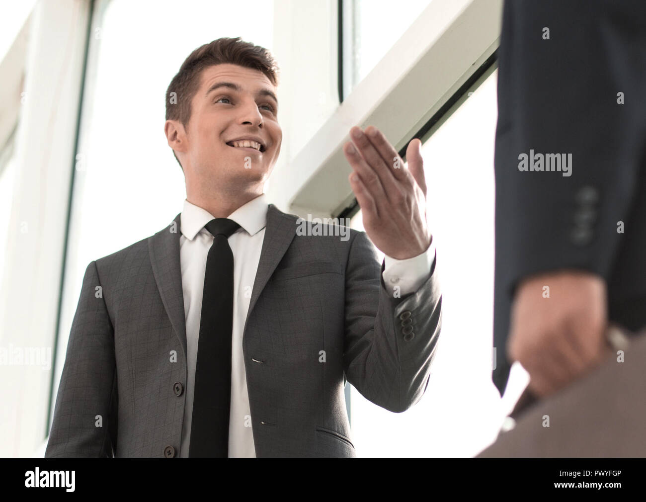 close up.business people standing near the office window Stock Photo ...