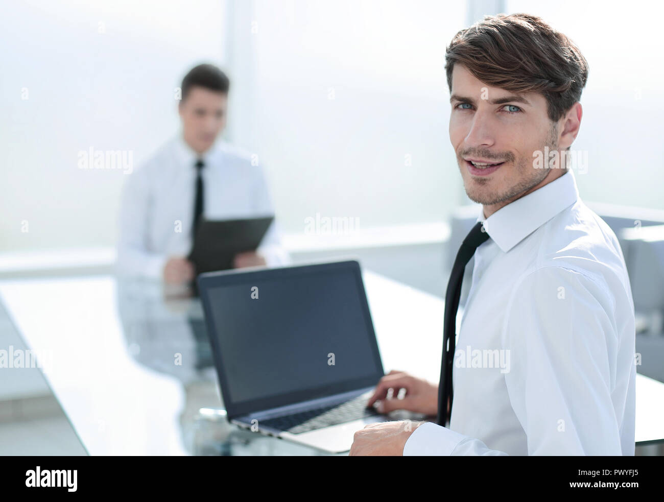 rear view.successful businessman sitting at the office Desk Stock Photo ...