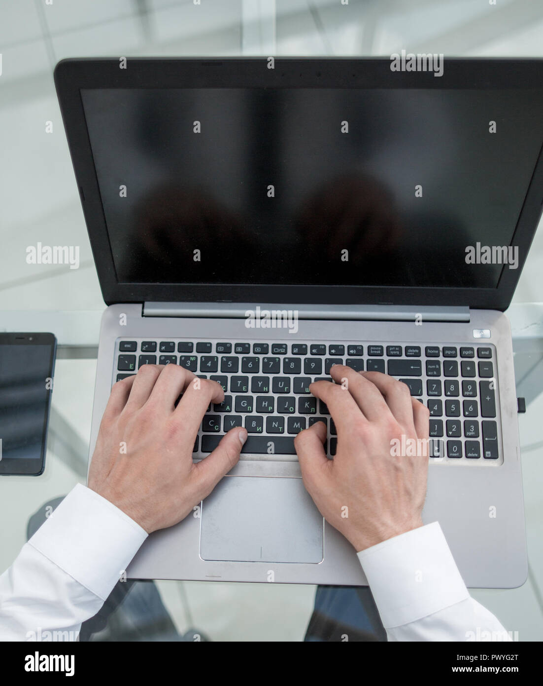 rear view.businessman working on a laptop Stock Photo - Alamy