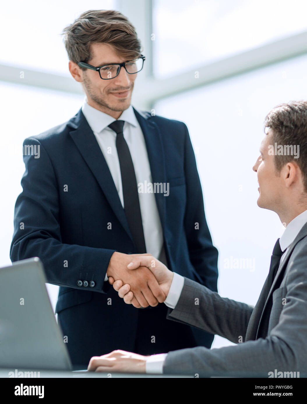 welcome handshake business colleagues in the office Stock Photo - Alamy
