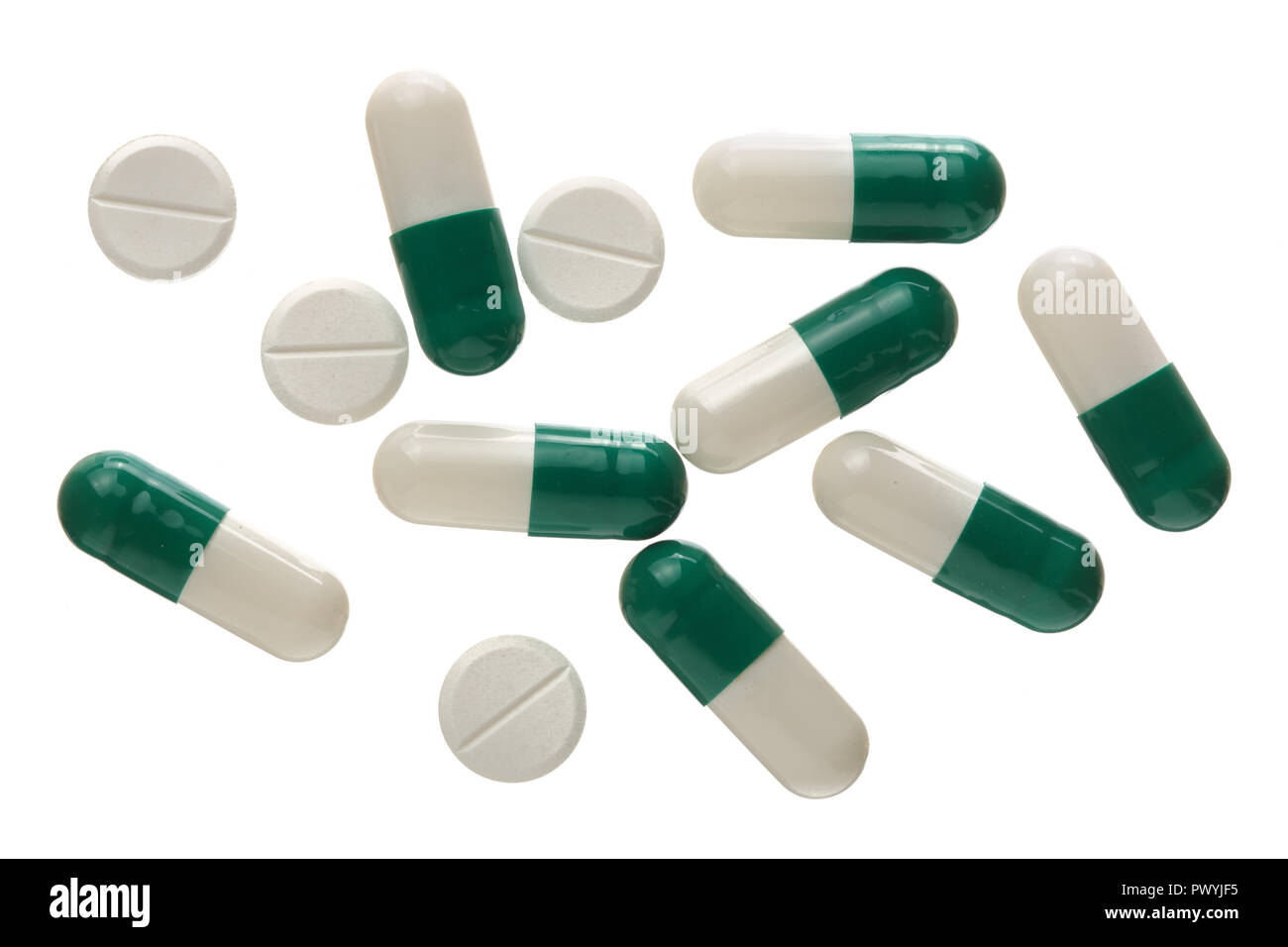 white and green pill capsule isolated on white background. Top view ...