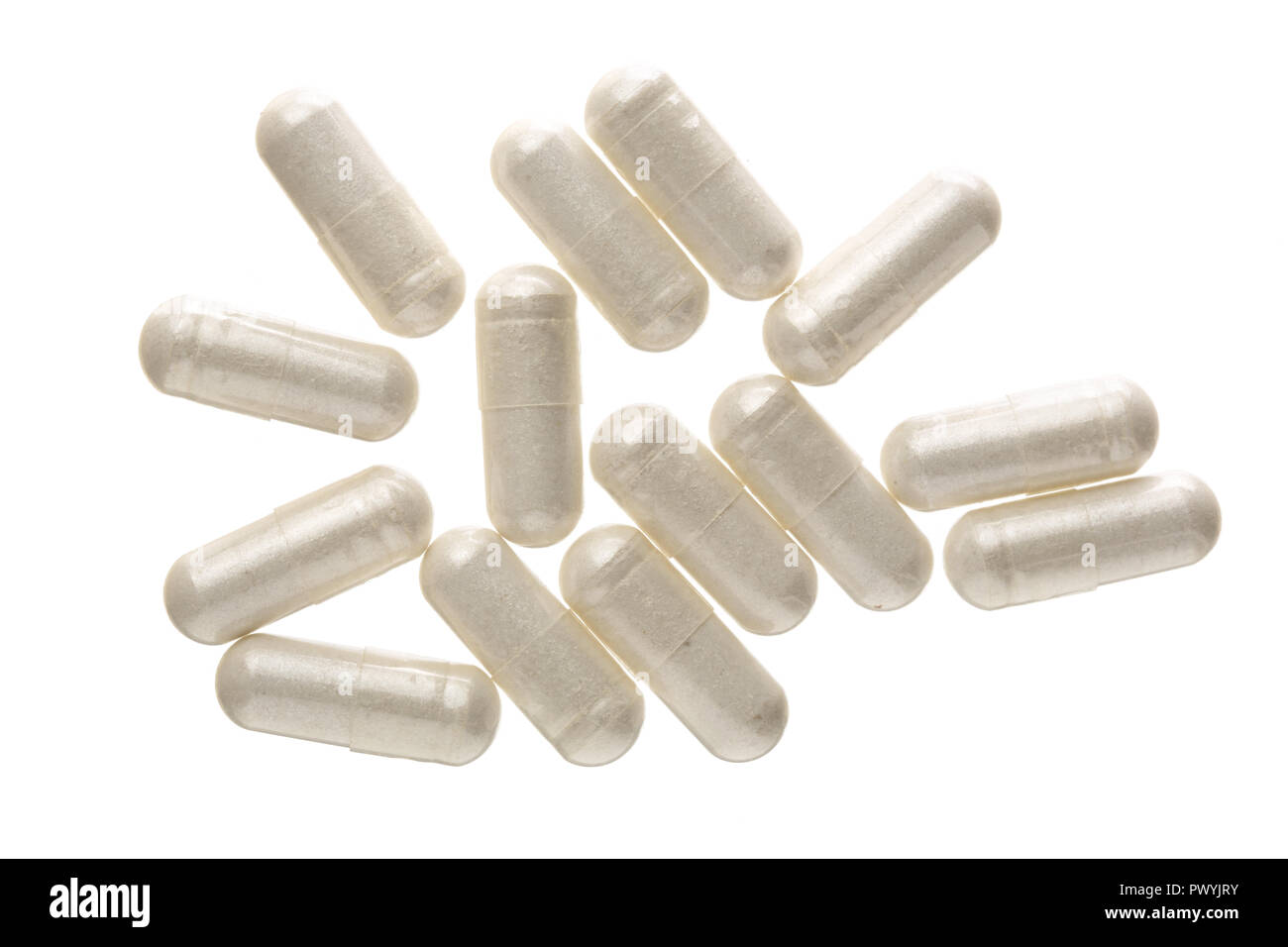 white pill capsule isolated on white background. Top view. Flat lay ...