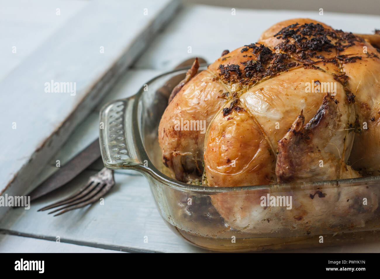 roasted chicken with garlic and butter on tray Stock Photo - Alamy
