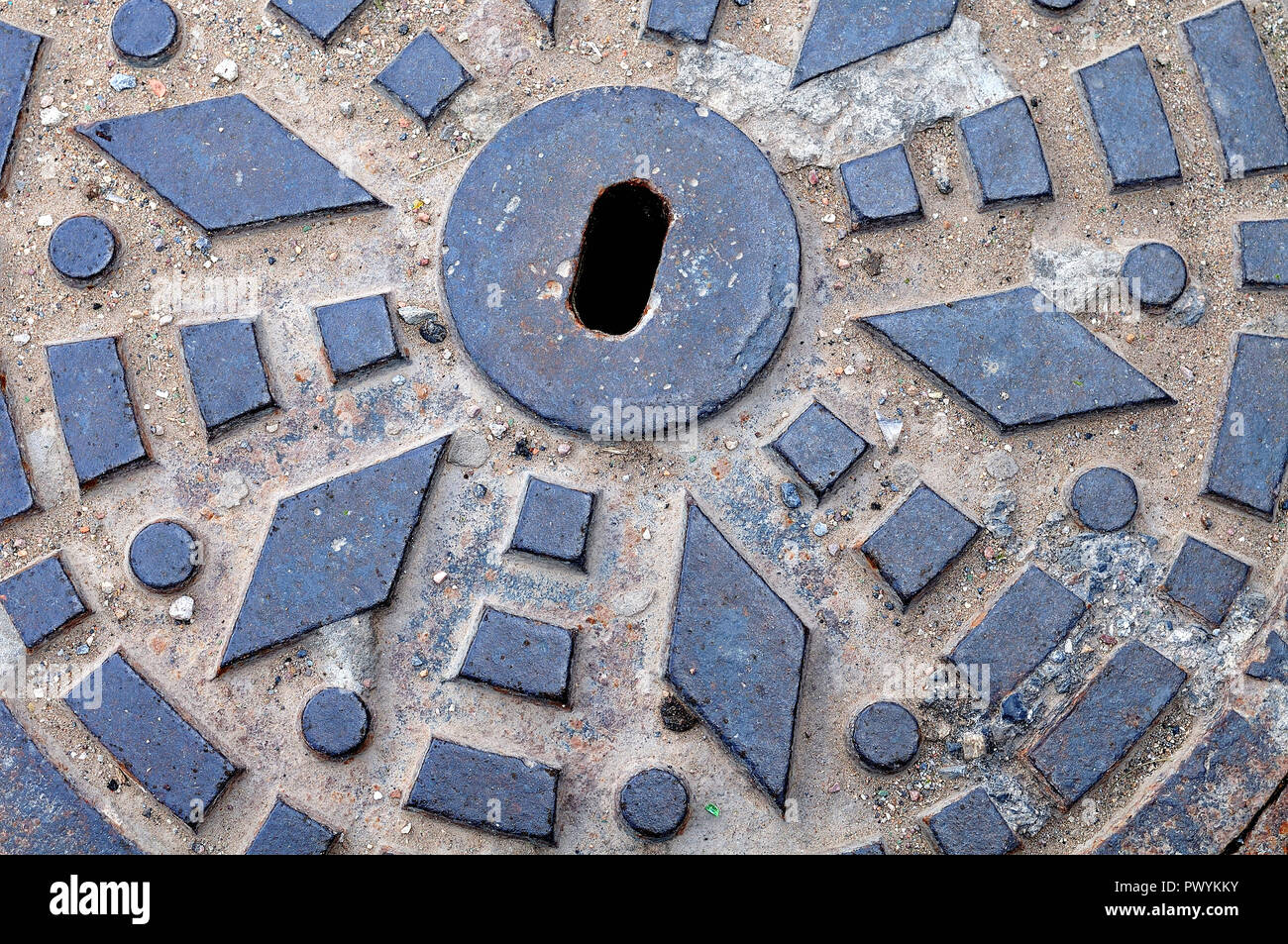 close-up of iron manhole cover with geometrical pattern Stock Photo - Alamy