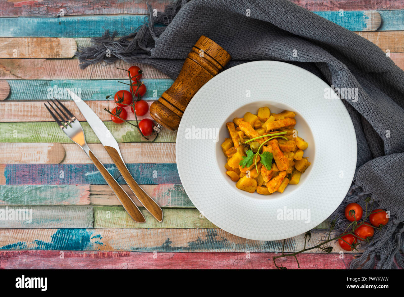 Fresh chicken steak with tomatoes and potatoes Stock Photo - Alamy