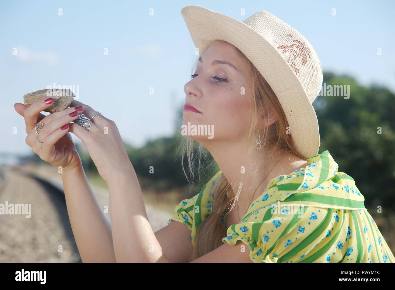 an amazing blonde lady with hat Stock Photo - Alamy