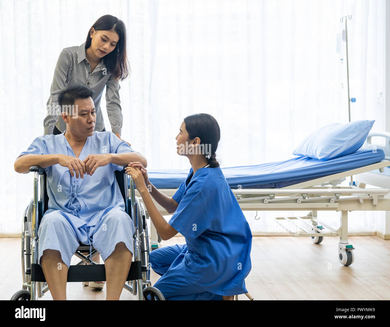 Physical therapist explain treatment method to senior patient and ...