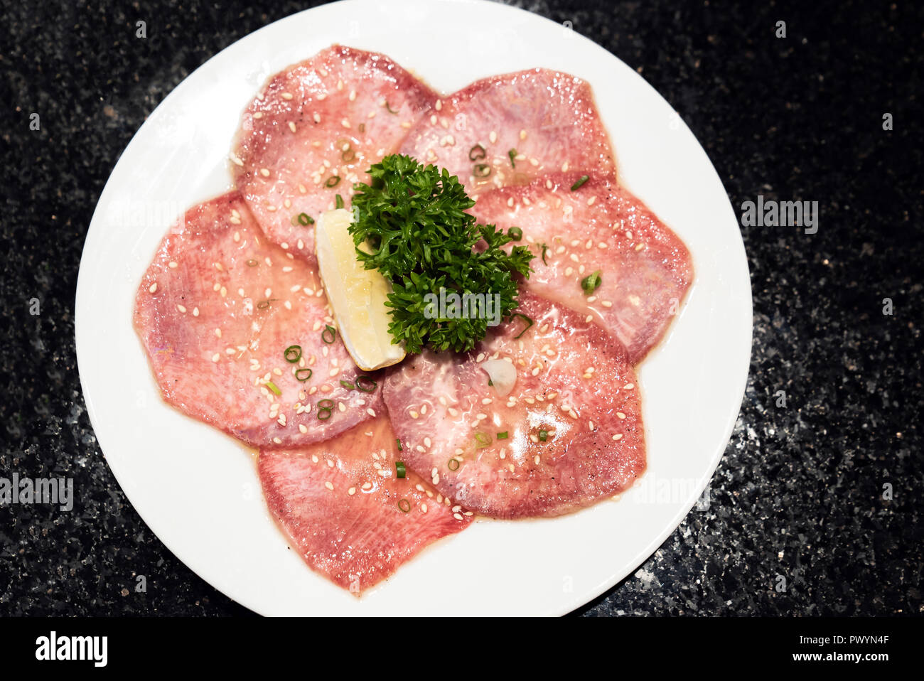 japanese grilled premium beef tongue yakiniku Stock Photo - Alamy