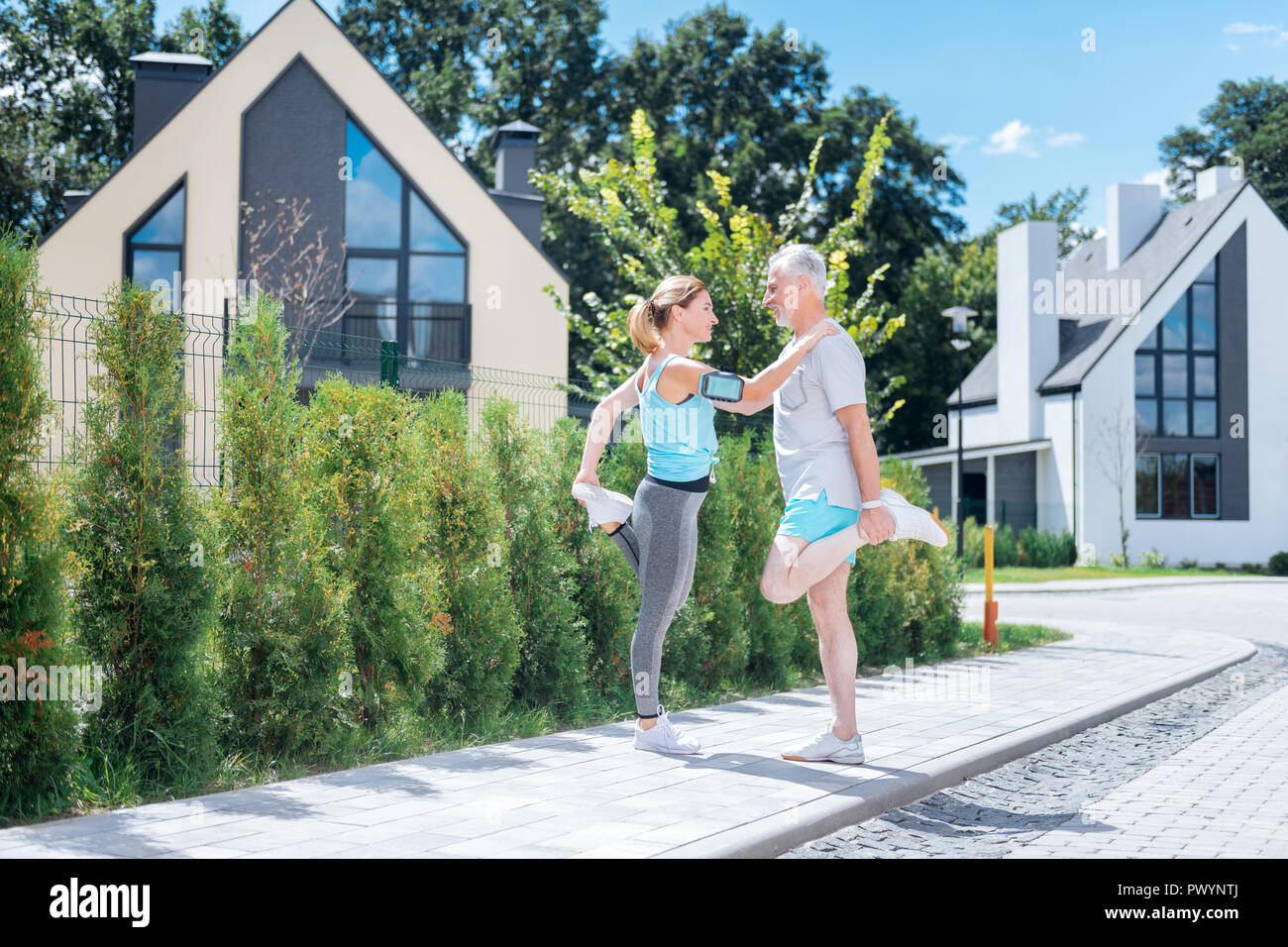 Bearded mature husband supporting his woman while doing morning ...