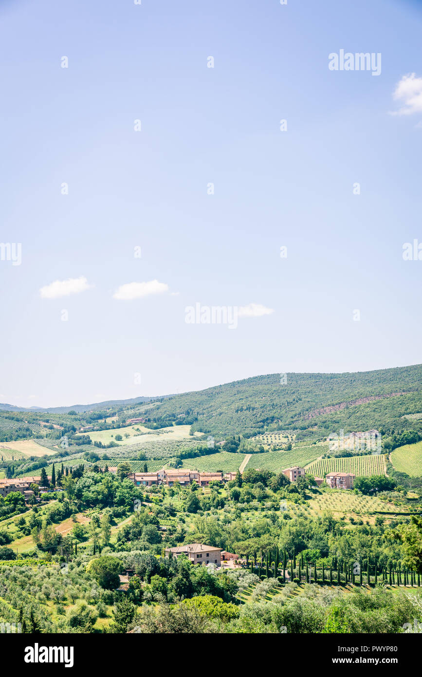 Vertical photo with view into Tuscany country. Land and hills are ...