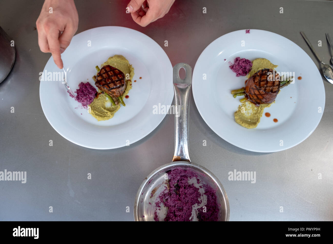 Chef in hotel or restaurant kitchen cooking only hands Stock Photo - Alamy