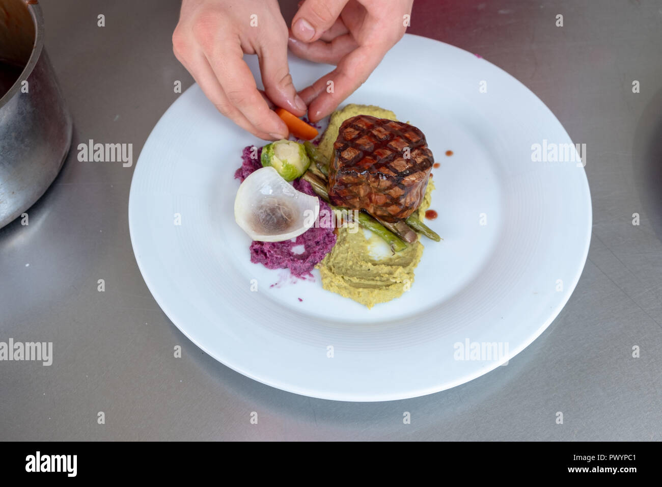 Chef in hotel or restaurant kitchen cooking only hands Stock Photo - Alamy