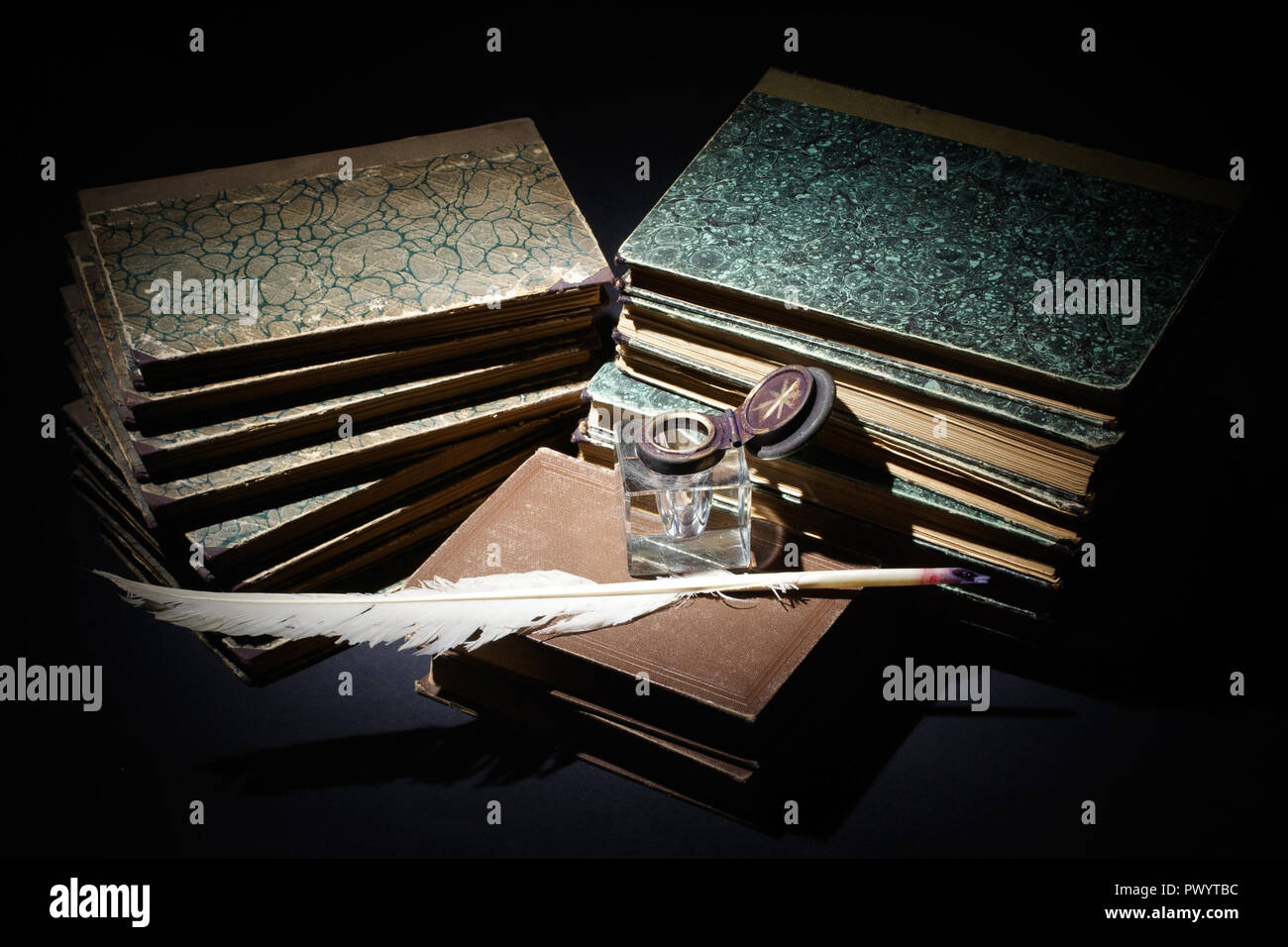 vintage concept - old books, papers, ink pen and inkpot on black ...