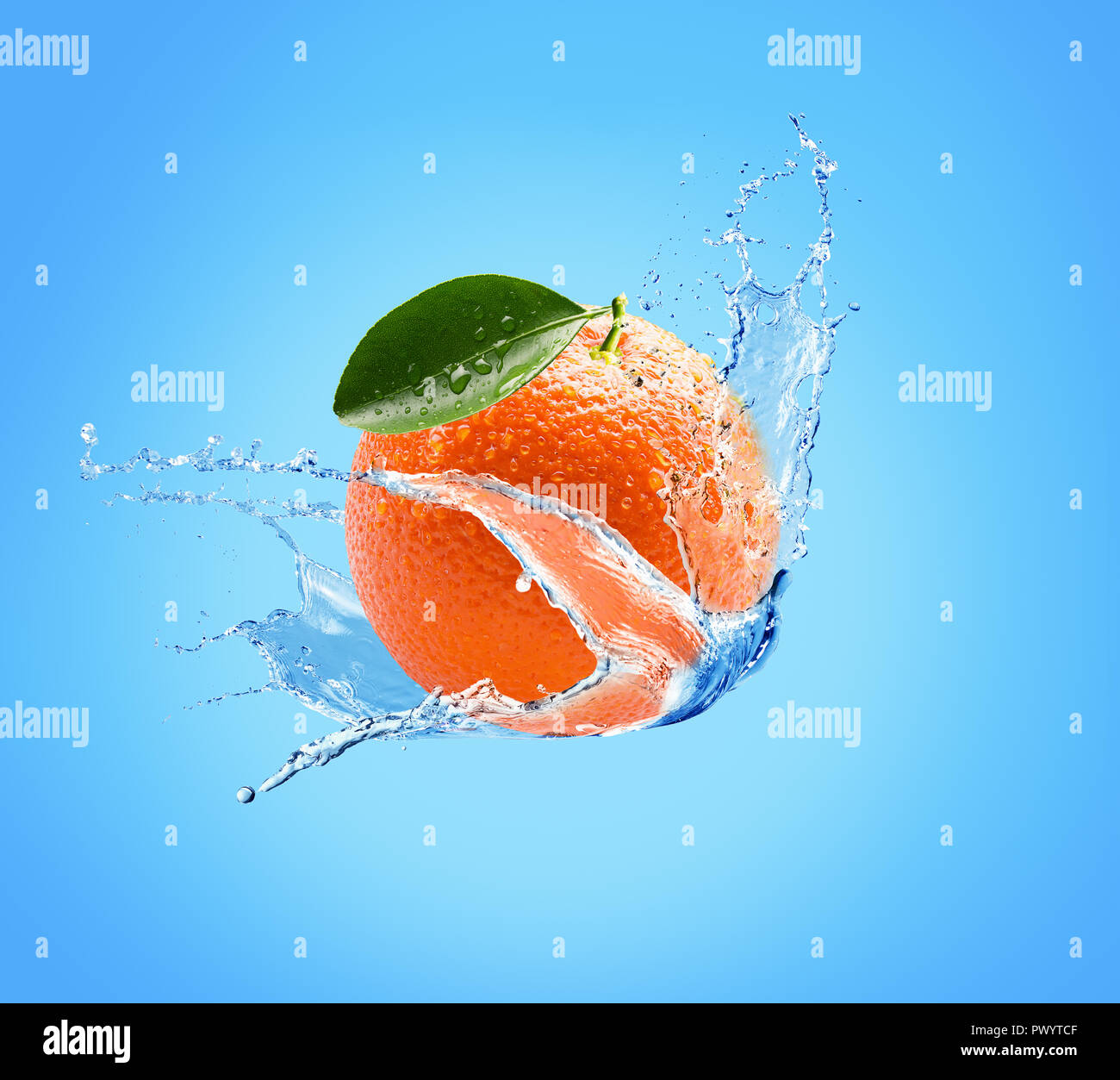 orange in water splash on a blue background Stock Photo - Alamy