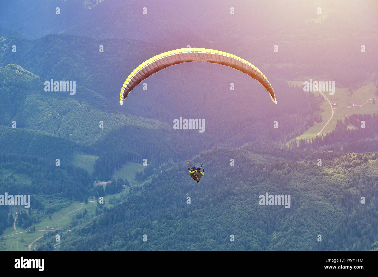 Paraglider taking off in front of spectacular mountain scenery Stock ...
