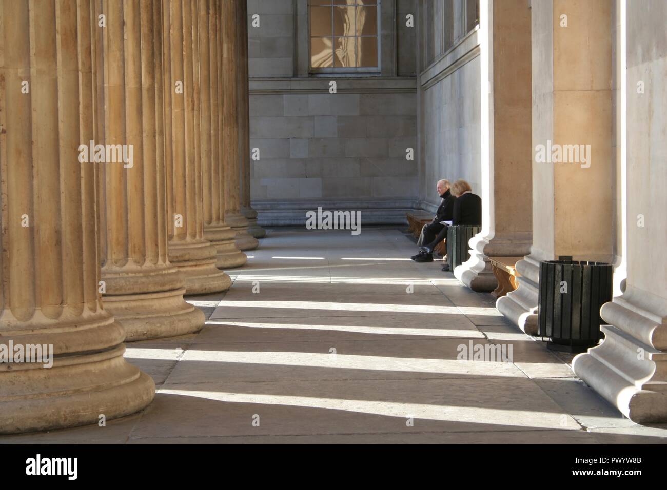 Taking a break between the shadows at the British Museum, London Stock ...