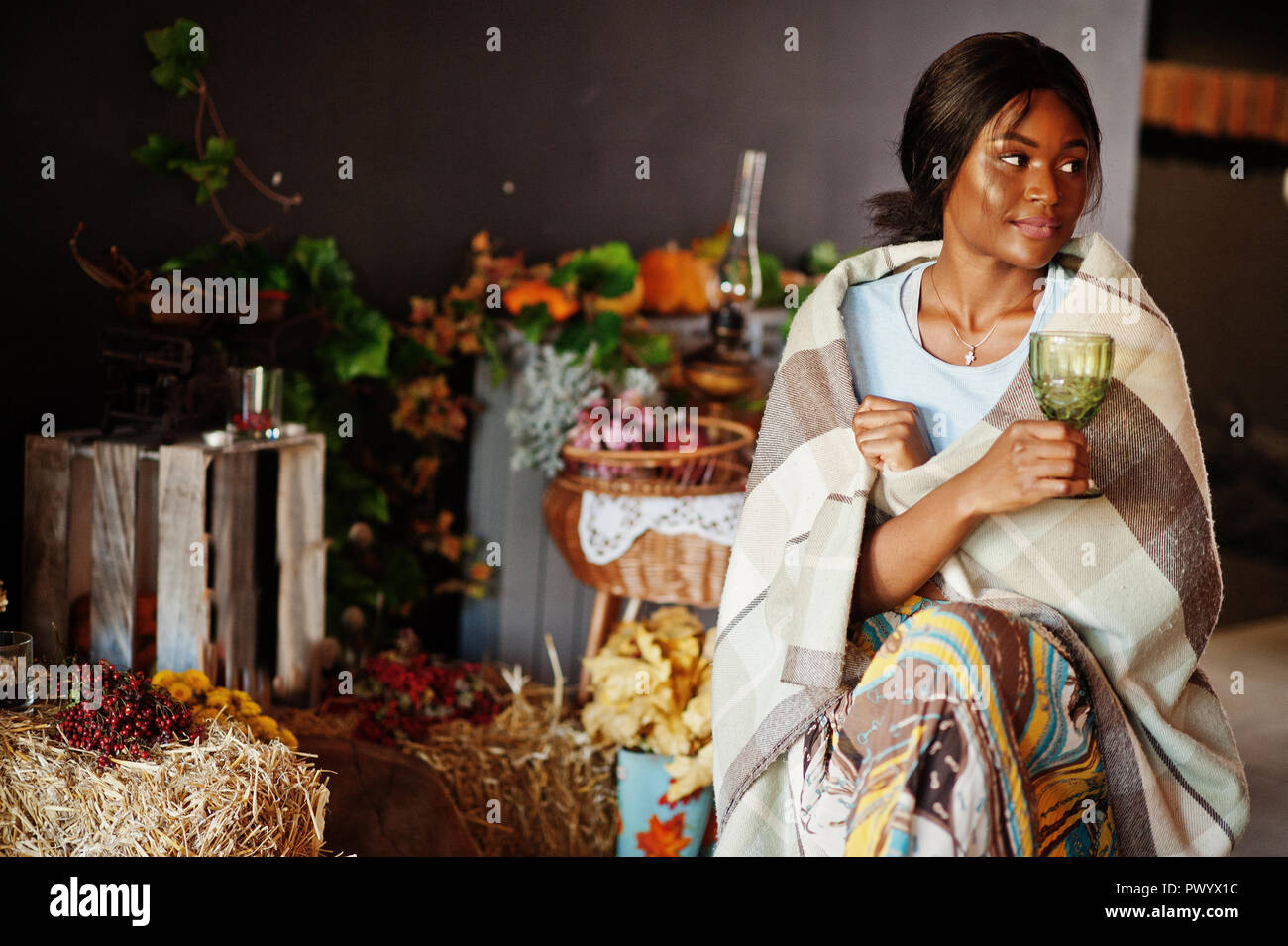 African american girl sitting at rocking chair against autumn mood ...