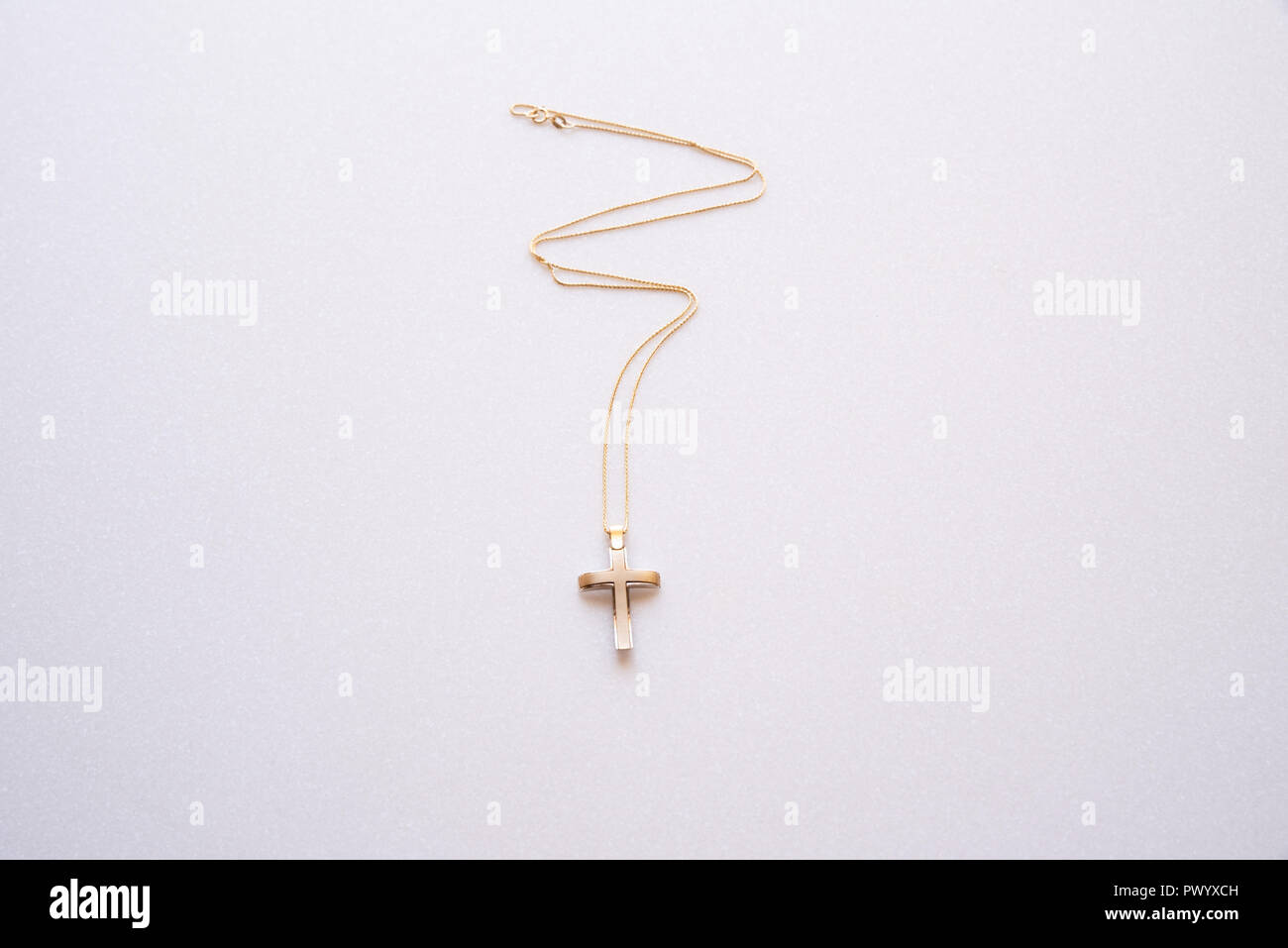 Christian cross and gold chain isolated on a white background Stock ...