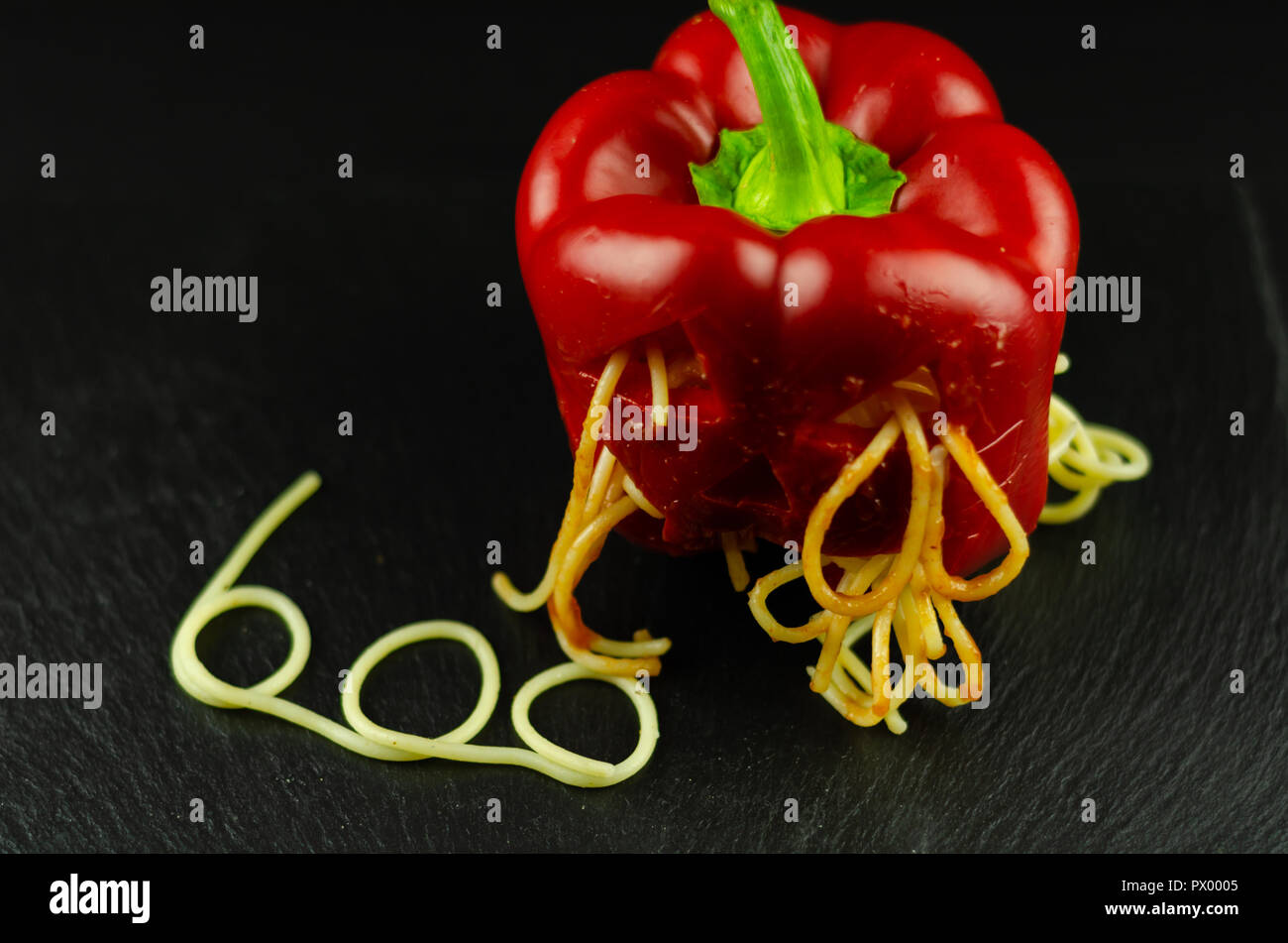 color stuffed peppers with scary cutout faces, halloween party food ...