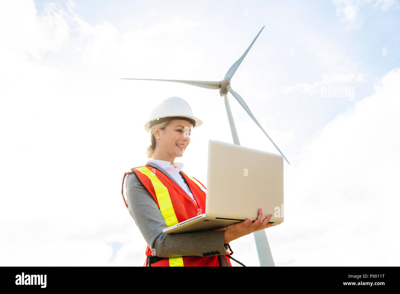 A Technician woman Engineer in Wind Turbine Power Generator Station ...