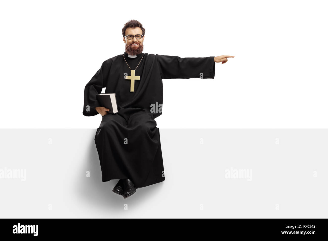 Priest sitting on a panel and pointing isolated on white background ...