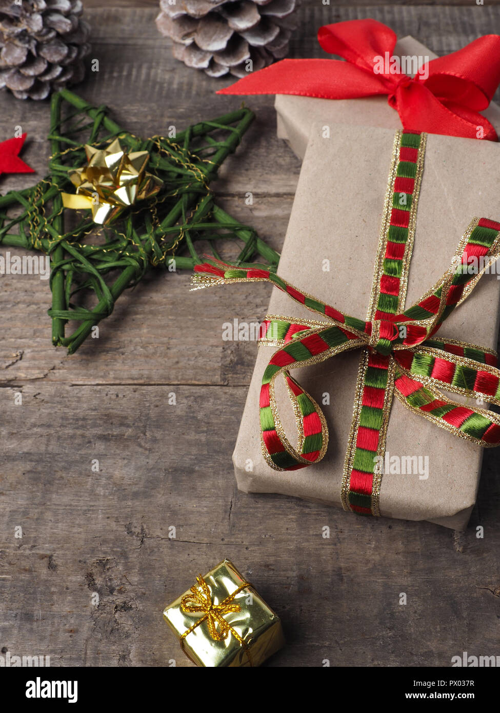 Christmas gifts with decoration on a rustic wooden floor using as ...