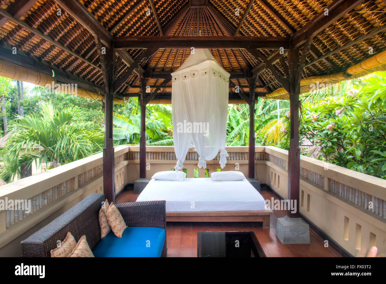 Fancy outdoor hotel room with view over the palm trees in Pemuteran in ...