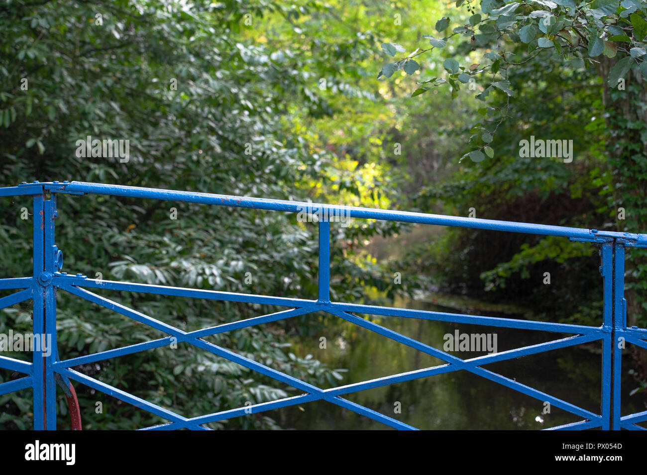 A blue painted bridge over the River Wylye near Bishopstrow, Warminster ...
