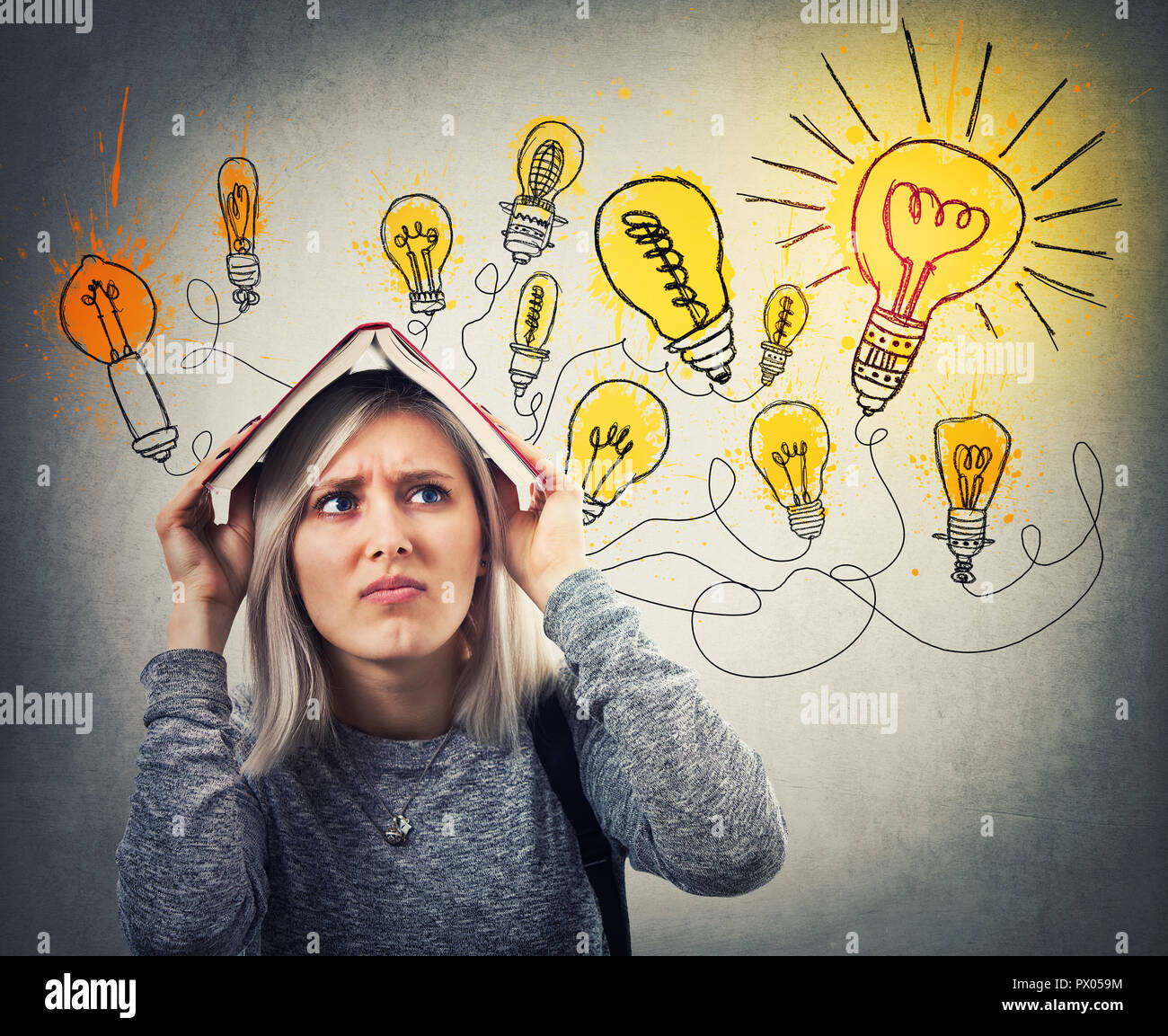 Perplexed young woman holding a opened book over head having many ideas ...