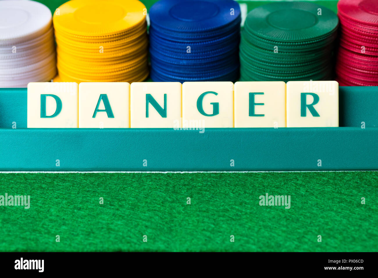 Gambling addiction abstract concept. Danger made out of letter tiles ...