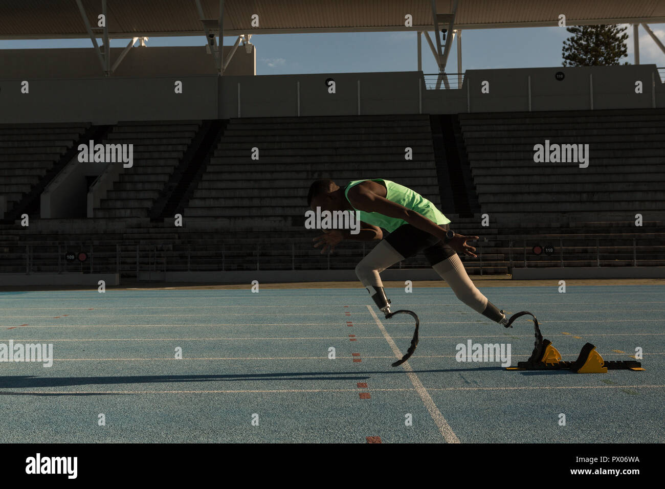 Disabled athletic running on a running track Stock Photo - Alamy