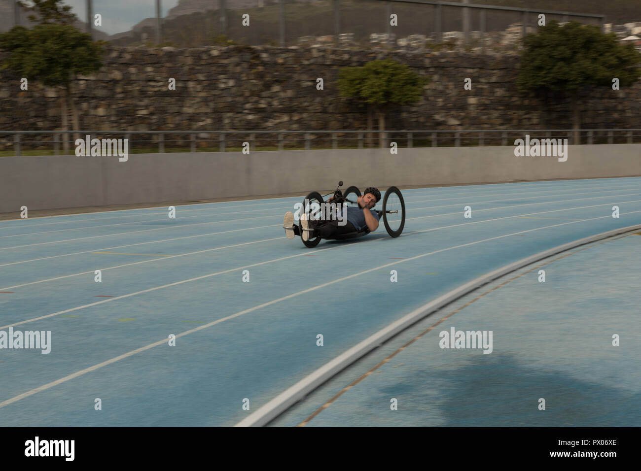Disabled athlete racing in wheelchair Stock Photo - Alamy