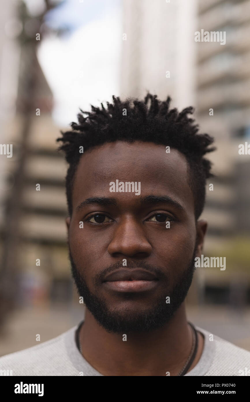 Man standing in city street Stock Photo - Alamy
