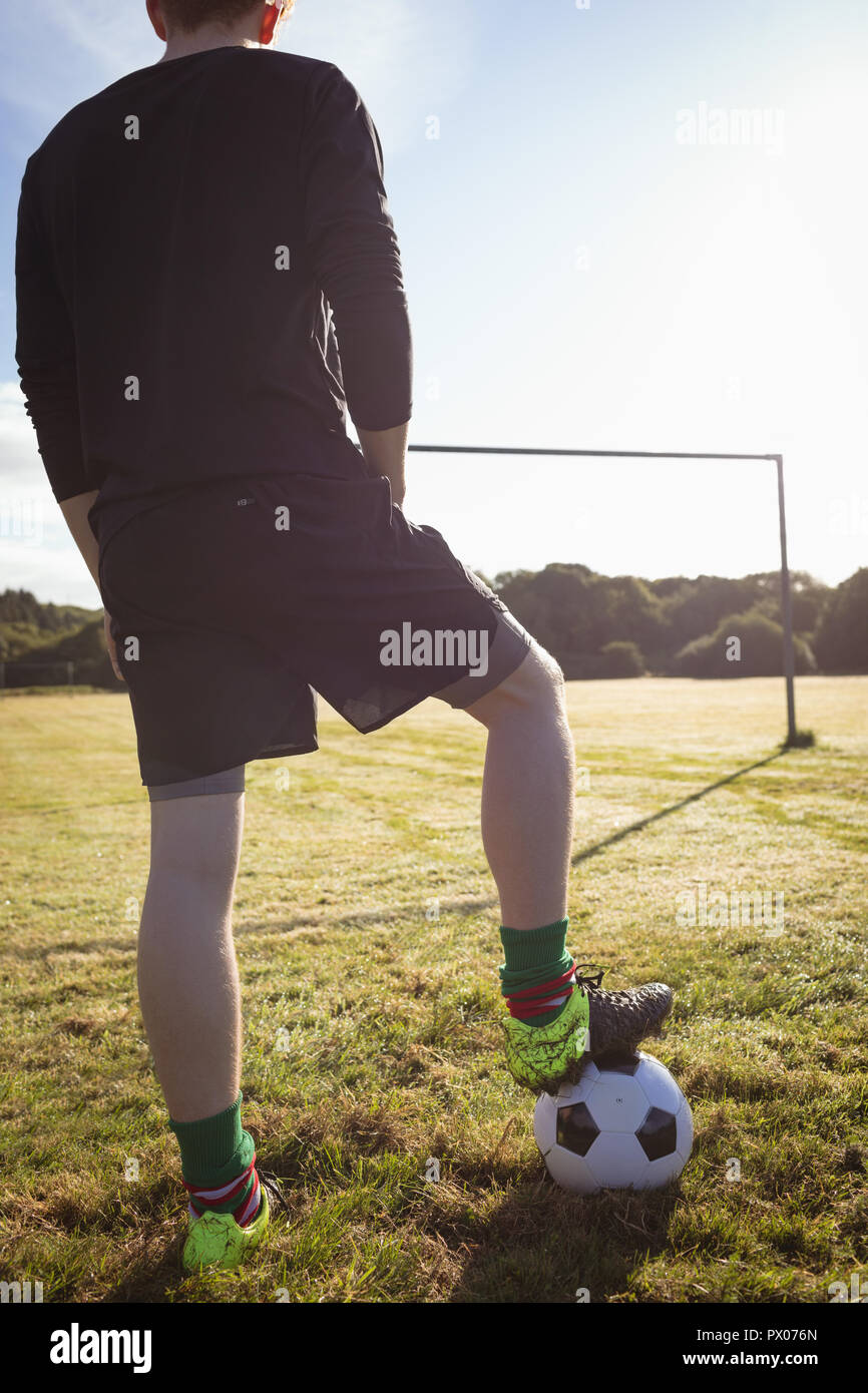 Football player standing ball hi-res stock photography and images - Alamy