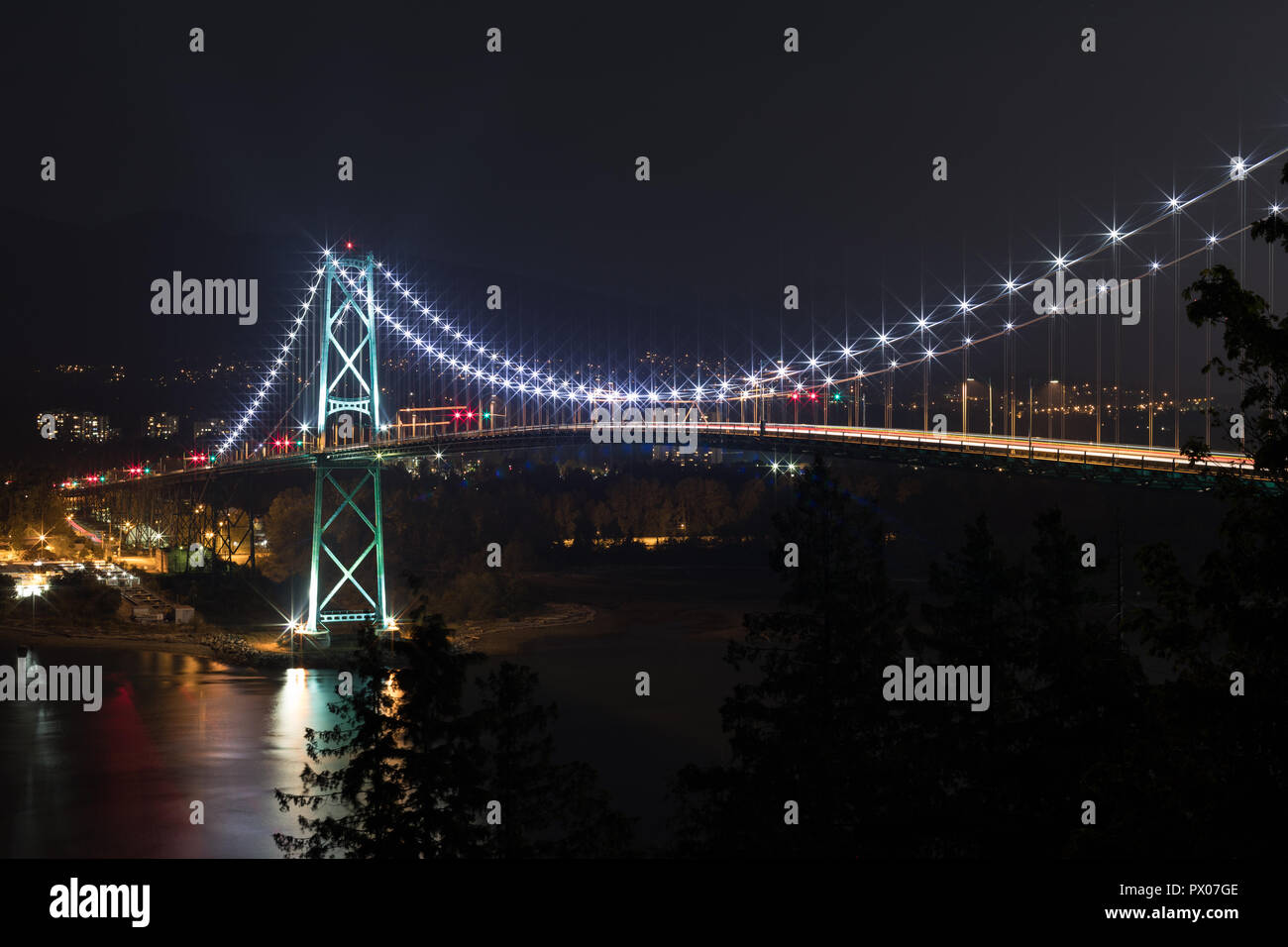 Suspension bridge with light trail Stock Photo - Alamy