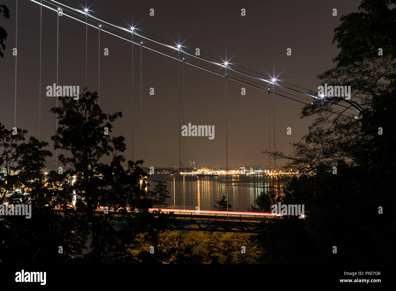Suspension bridge with light trail Stock Photo - Alamy