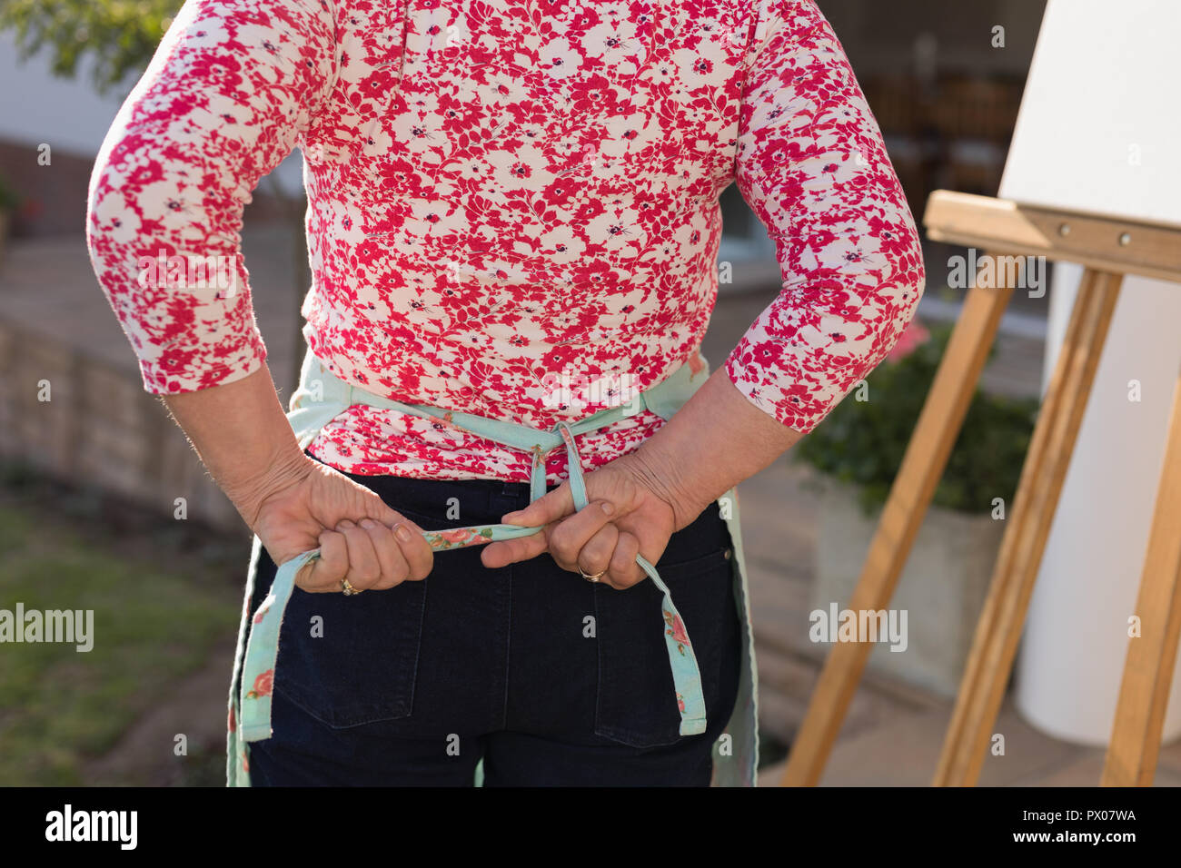 Senior woman in apron hi-res stock photography and images - Alamy