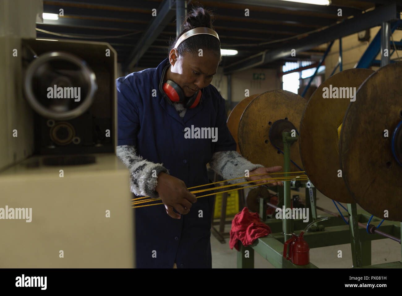 Worker working in rope making industry Stock Photo - Alamy
