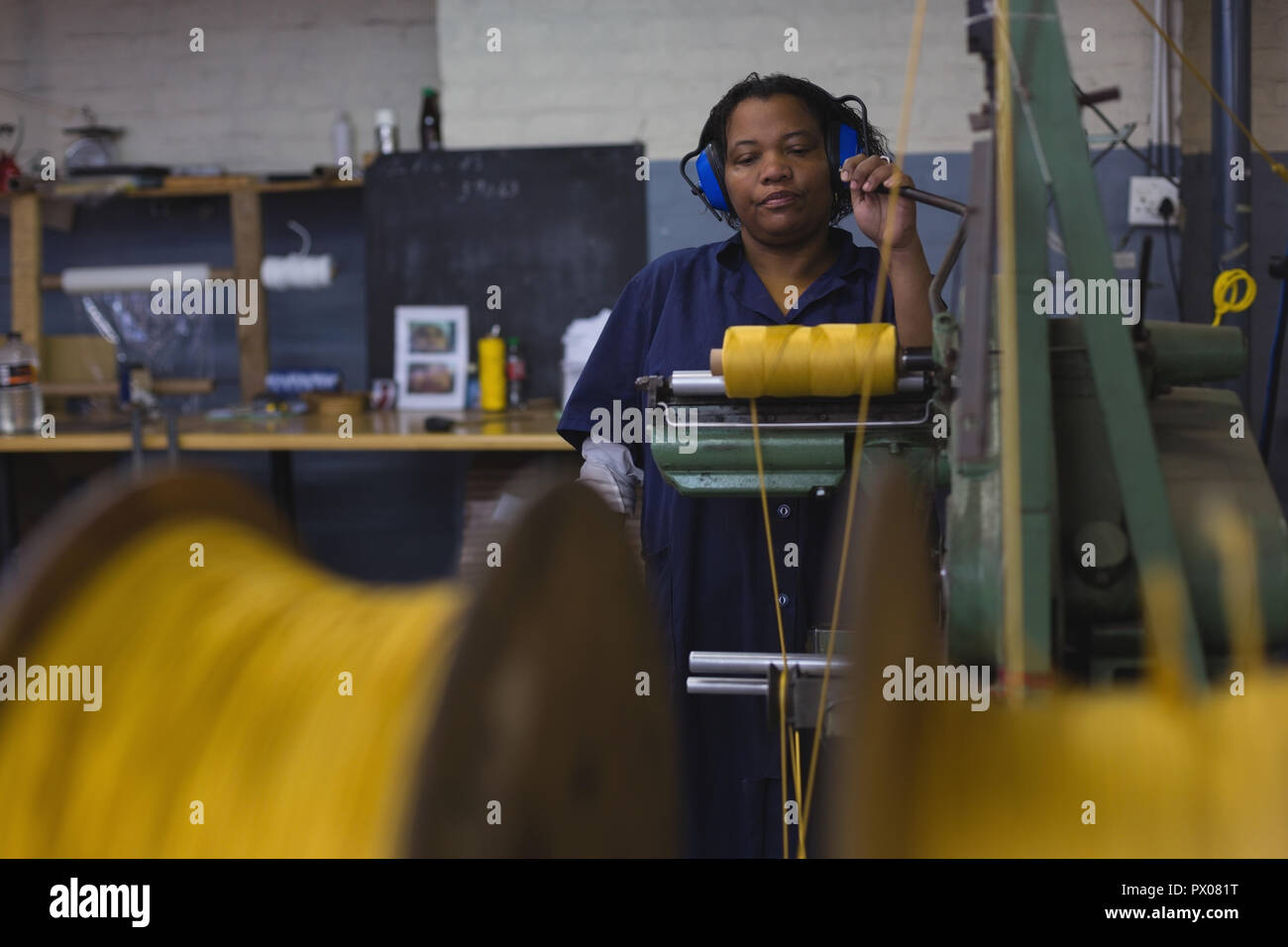 Worker working in rope making industry Stock Photo - Alamy